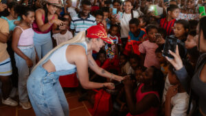 Karol G’s Con Cora Foundation Turns Holiday Cheer Into Real Change for ...